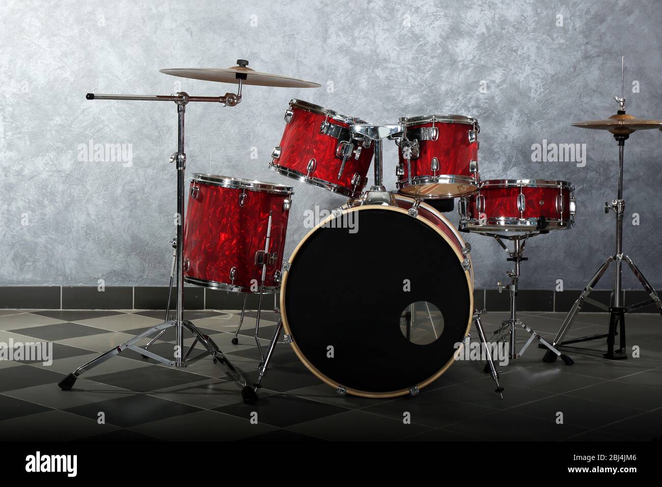 Drum set on brick wall background Stock Photo - Alamy