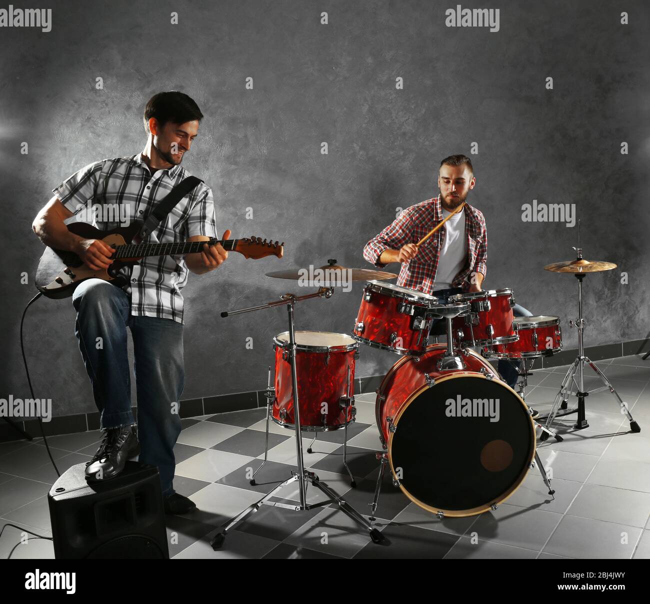 Musicians playing the drums in a studio Stock Photo - Alamy
