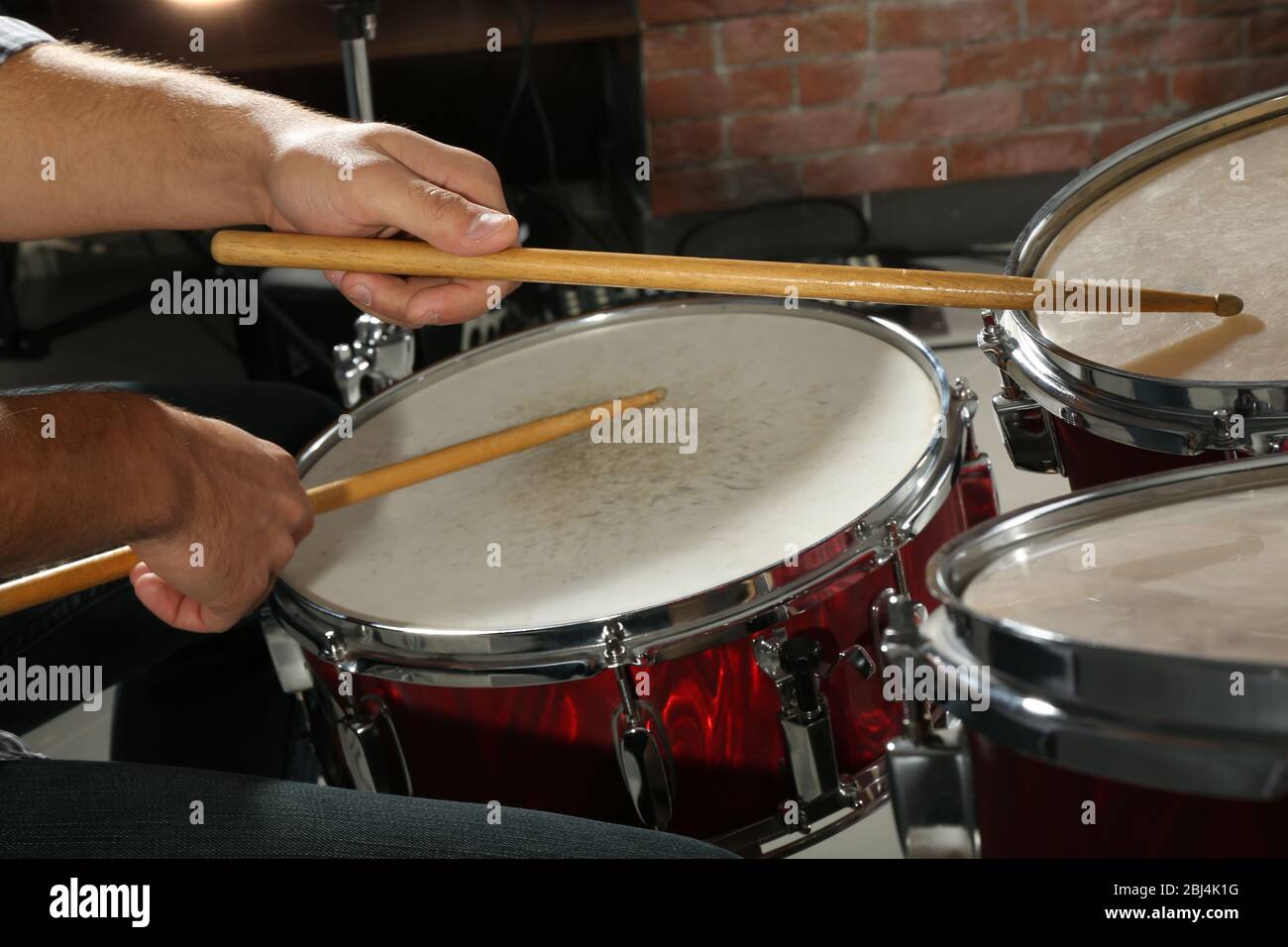 Musician playing the drums closeup Stock Photo - Alamy
