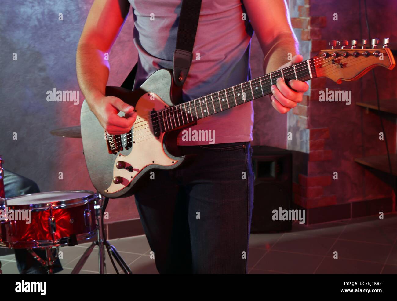 Musicians playing musical instruments and singing songs in a studio ...