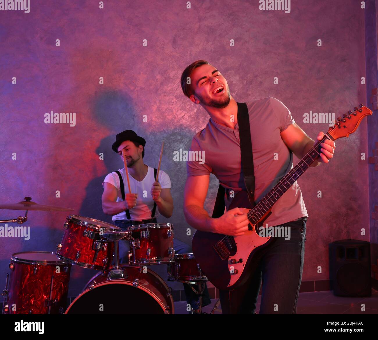 Musicians playing musical instruments in a studio Stock Photo - Alamy
