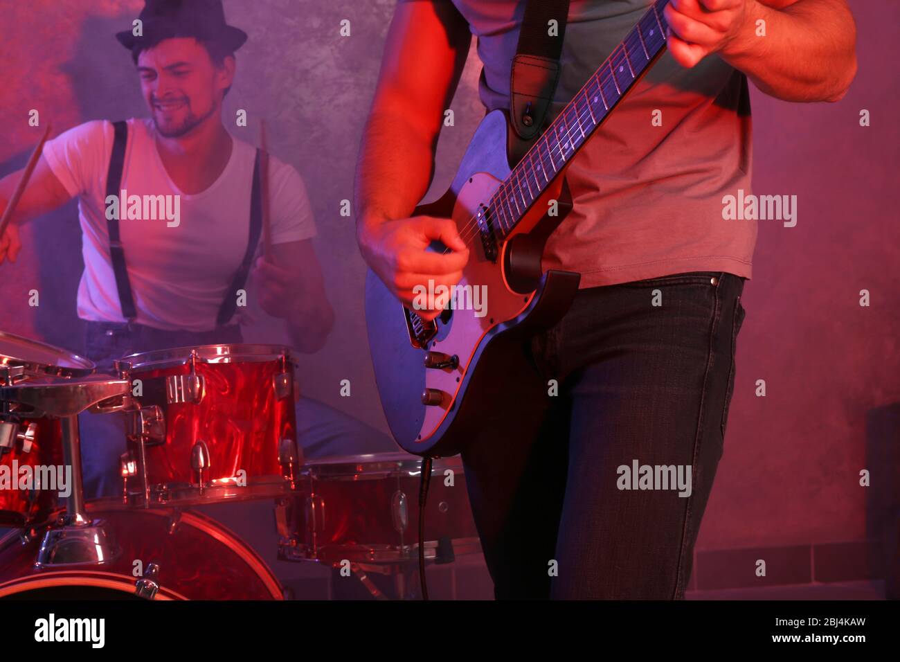 Musicians playing musical instruments in a studio Stock Photo - Alamy