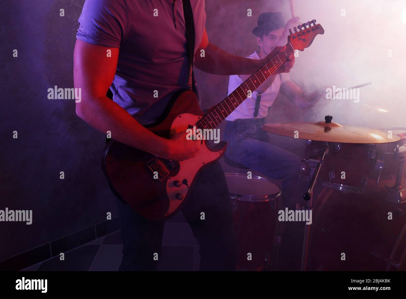 Musicians playing musical instruments in a studio Stock Photo - Alamy