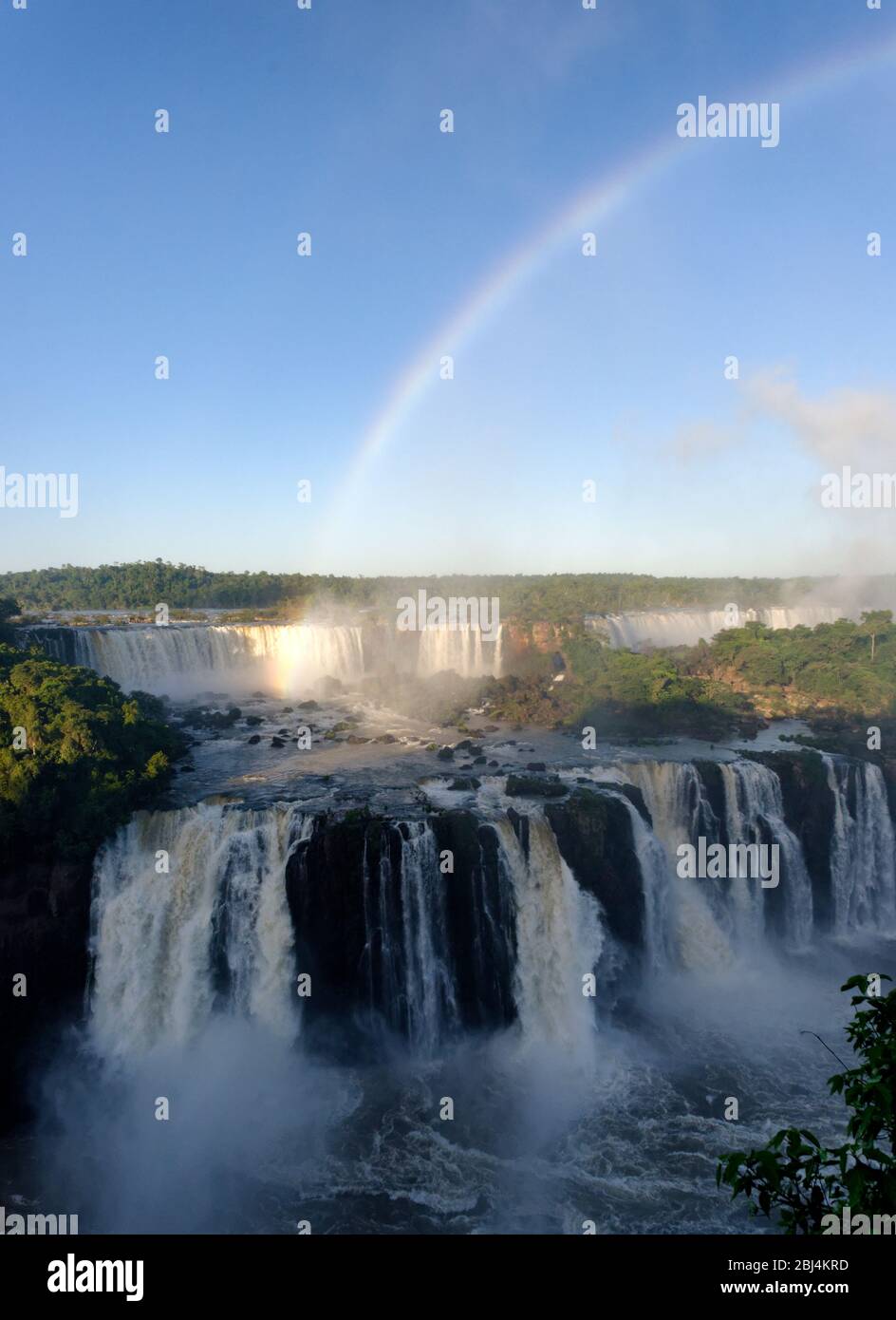 Rainbow over the Devils Throat waterfall, part of the Iguacu waterfalls ...