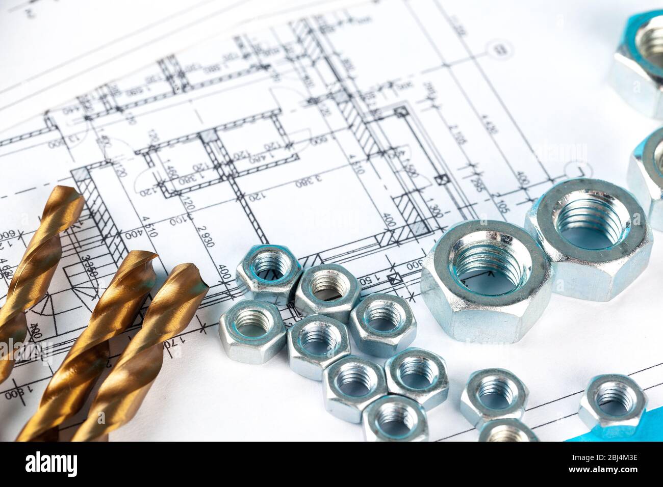 nuts and parts of the construction are laid out in a dented drawing ...