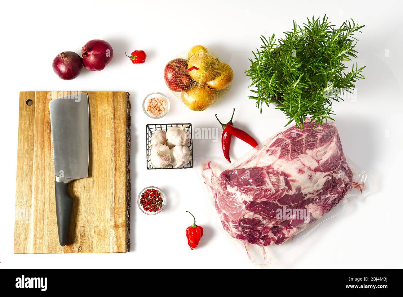 Flat lay at domestic kitchen cooking concept on white table. raw pork ...