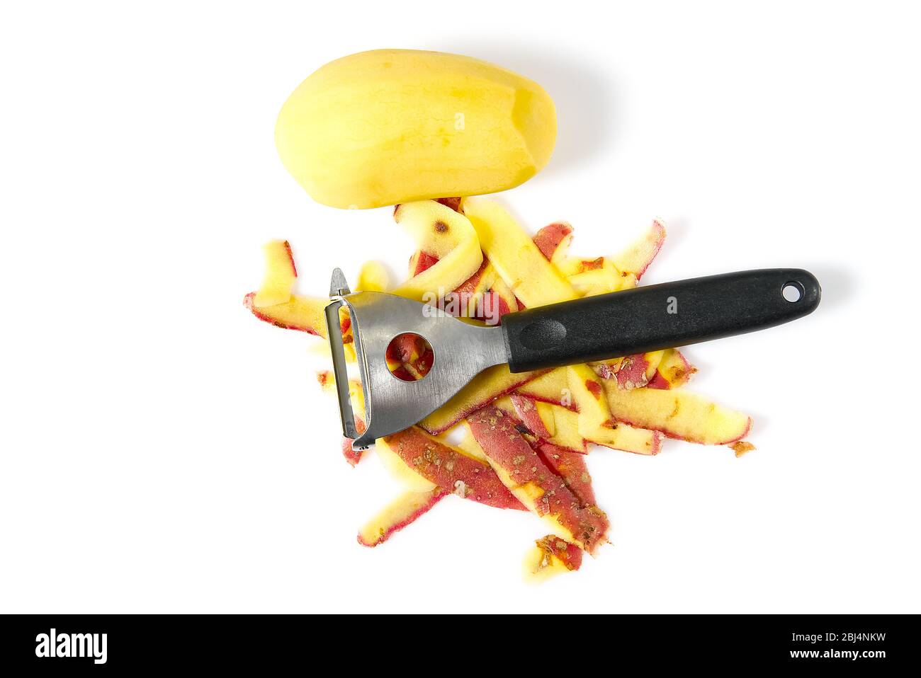 a pile of unpeeled potatoes and black potatoes peeling, white ...