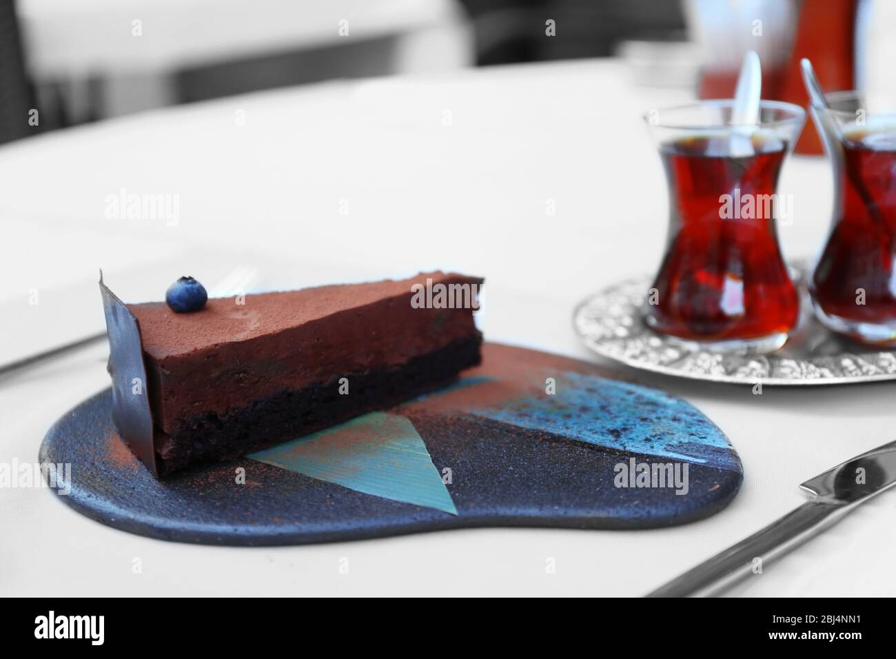 Cup of tea and cake on a table in cafe Stock Photo - Alamy