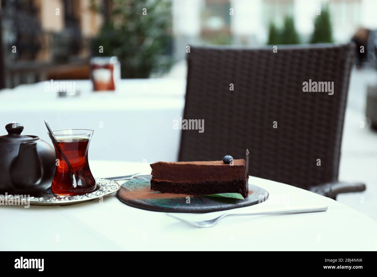 Cup of tea and cake on a table in cafe Stock Photo - Alamy
