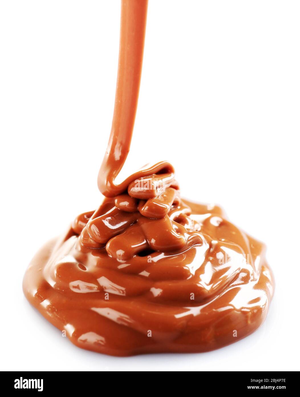 Milky brown chocolate pouring, isolated on white Stock Photo - Alamy
