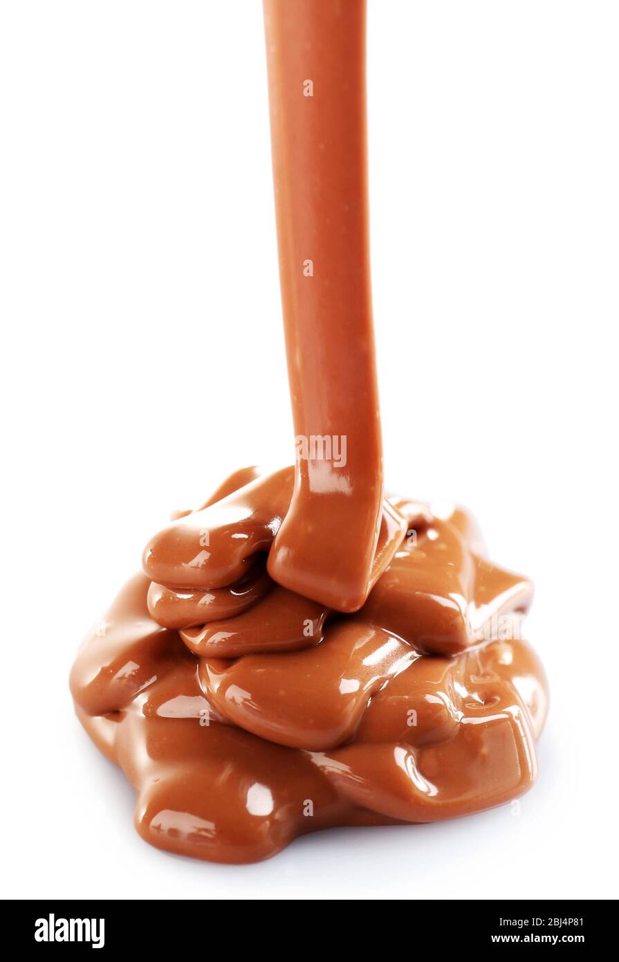 Milky brown chocolate pouring, isolated on white Stock Photo - Alamy