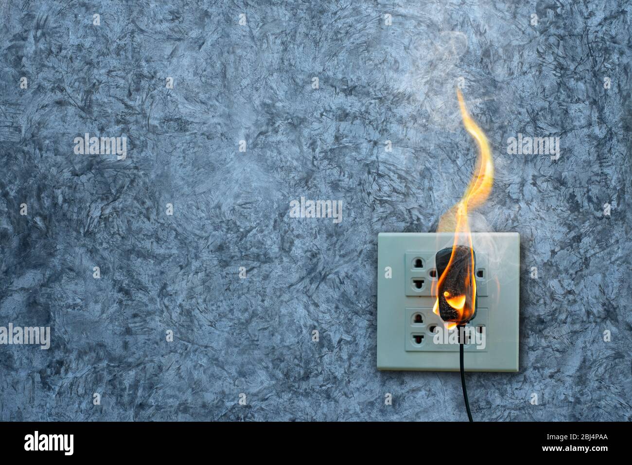 On fire charger adapter on the concrete wall exposed concrete ...