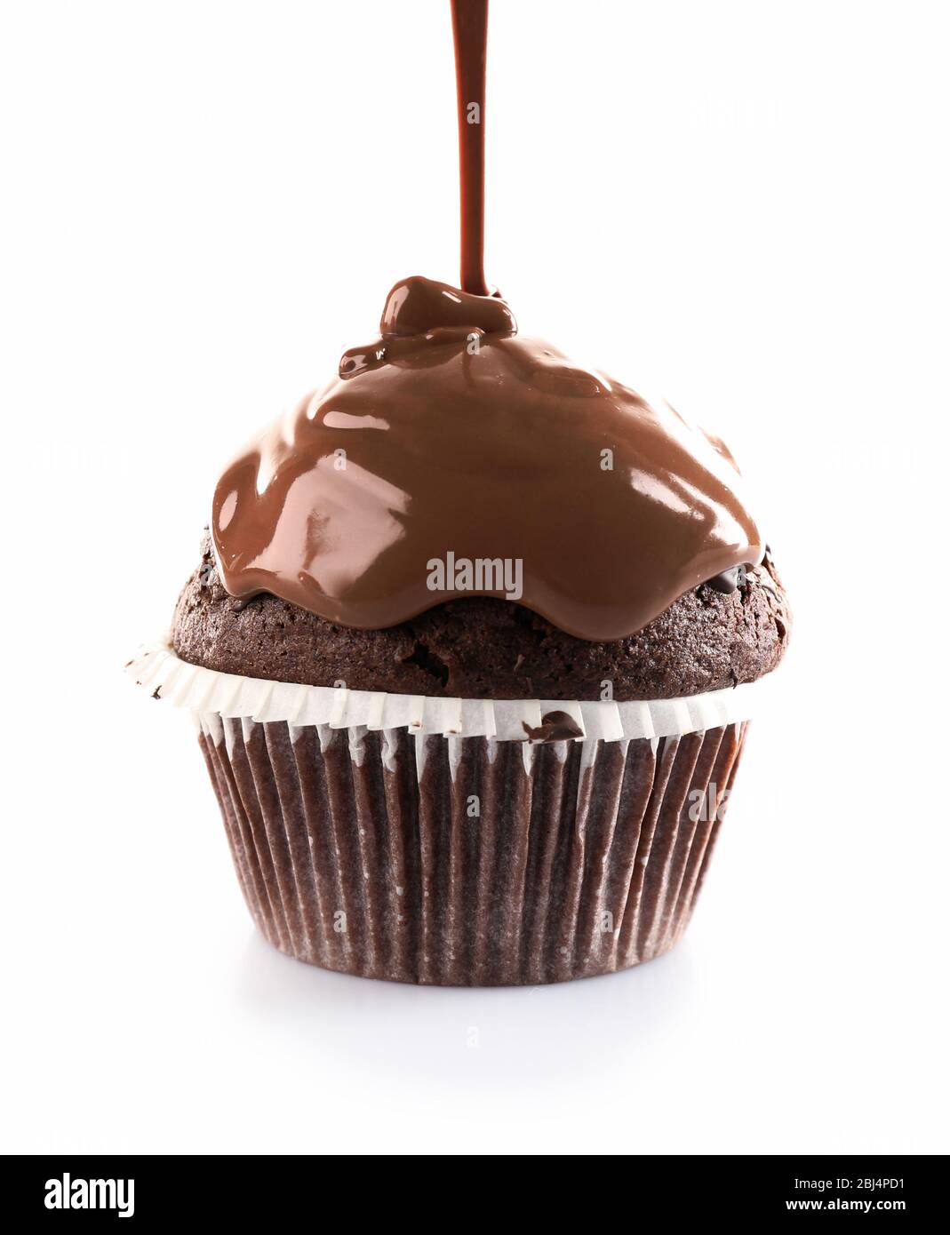 Delicious cupcake with melted chocolate topping, isolated on white ...