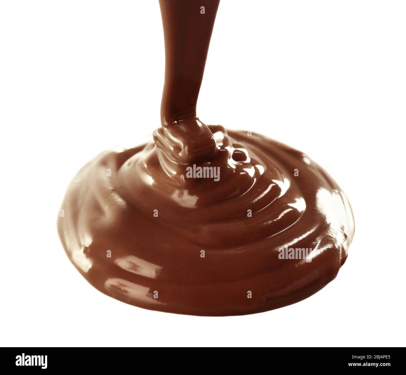 Melted milky brown chocolate pouring, isolated on white Stock Photo - Alamy