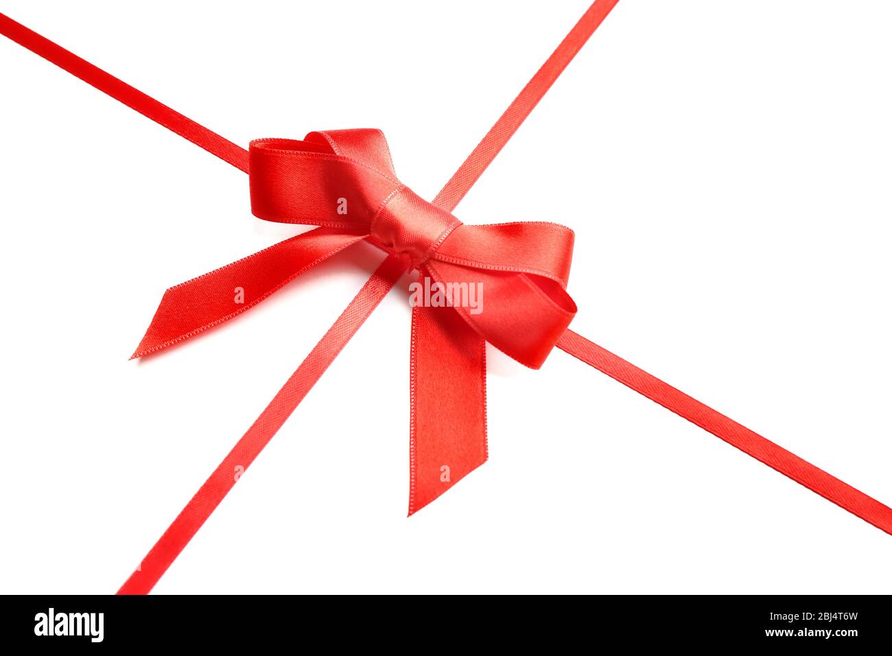 Shiny red ribbon with bow isolated on white Stock Photo - Alamy