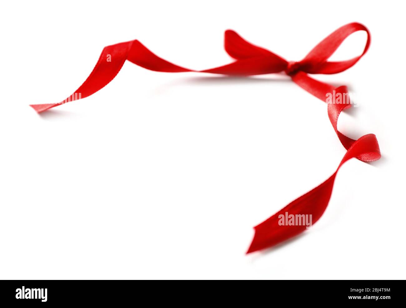 Shiny red bow isolated on white Stock Photo - Alamy