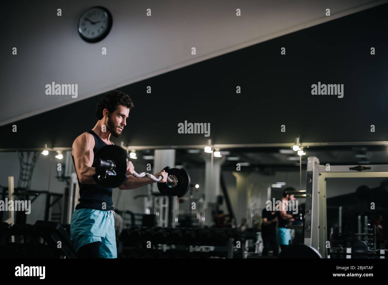 Slim bearded young man with muscular wiry body wearing sportswear ...