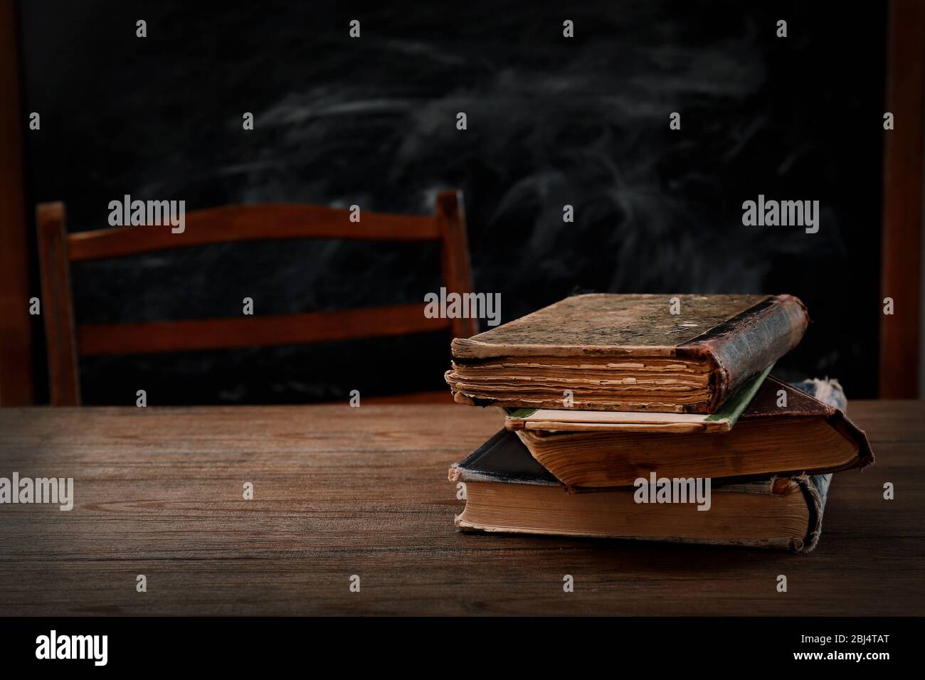 Few books on wooden table Stock Photo - Alamy