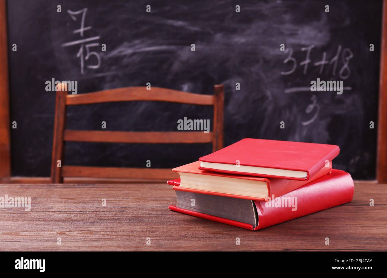 Few books on wooden table Stock Photo - Alamy