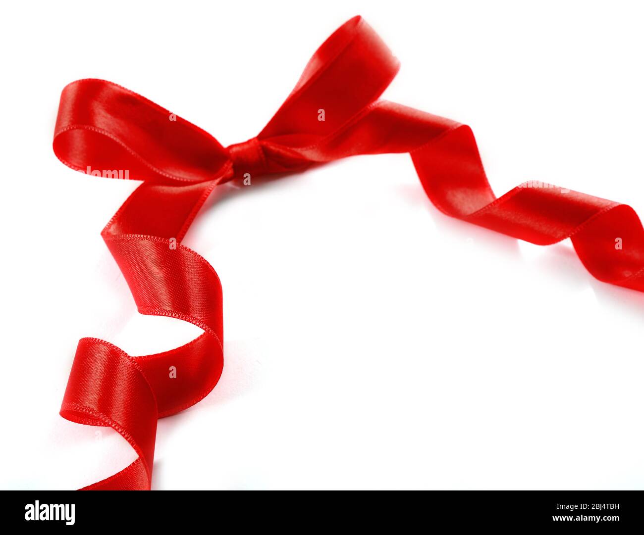 Shiny red bow isolated on white Stock Photo - Alamy