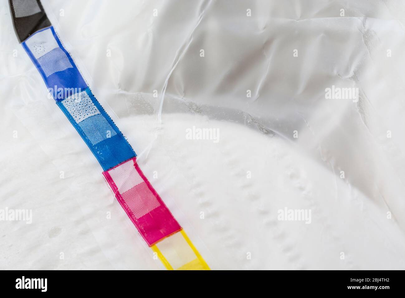 Colour registration strip on plastic packaging. For CMYK process ...