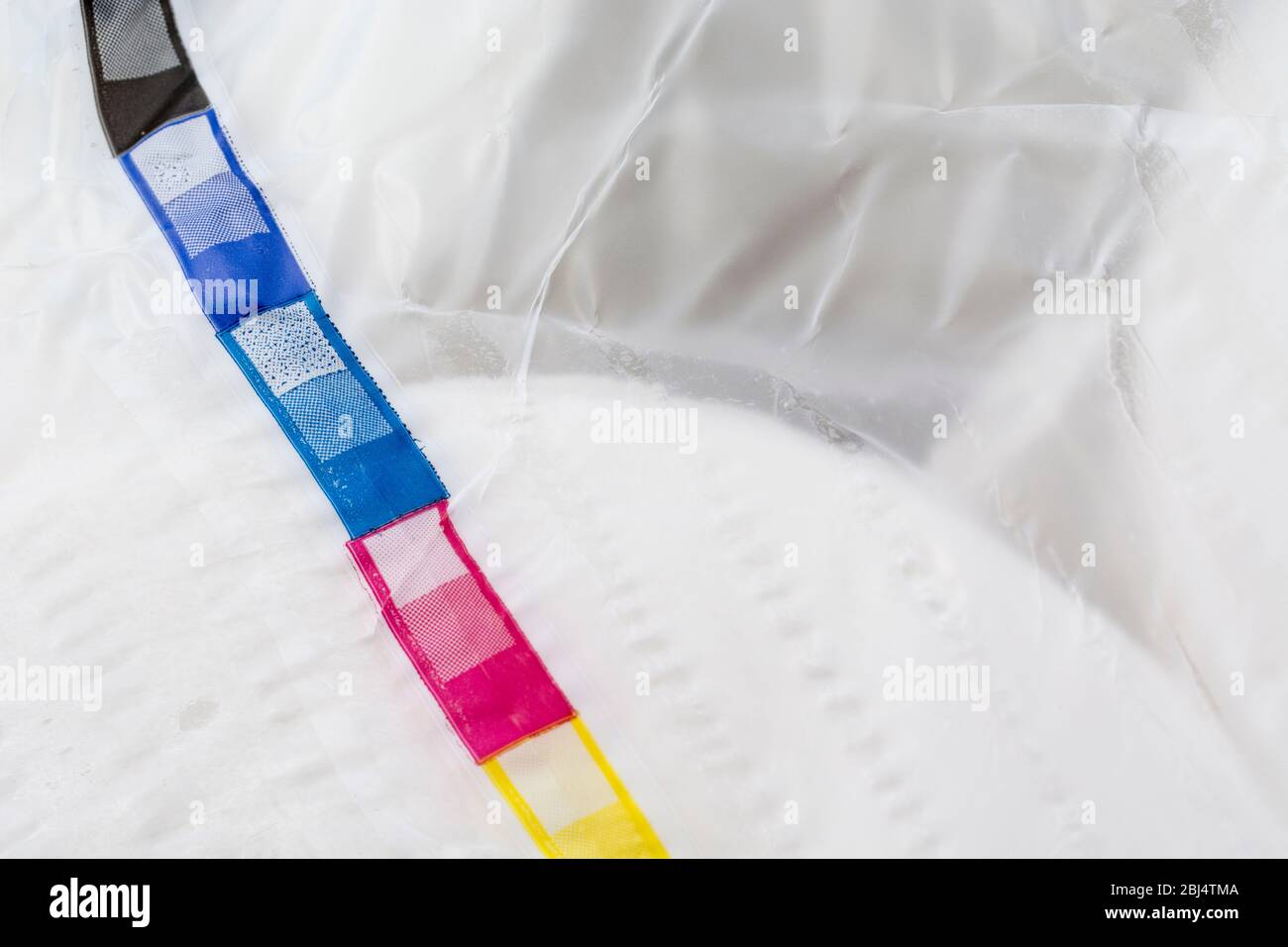 Colour registration strip on plastic packaging. For CMYK process ...