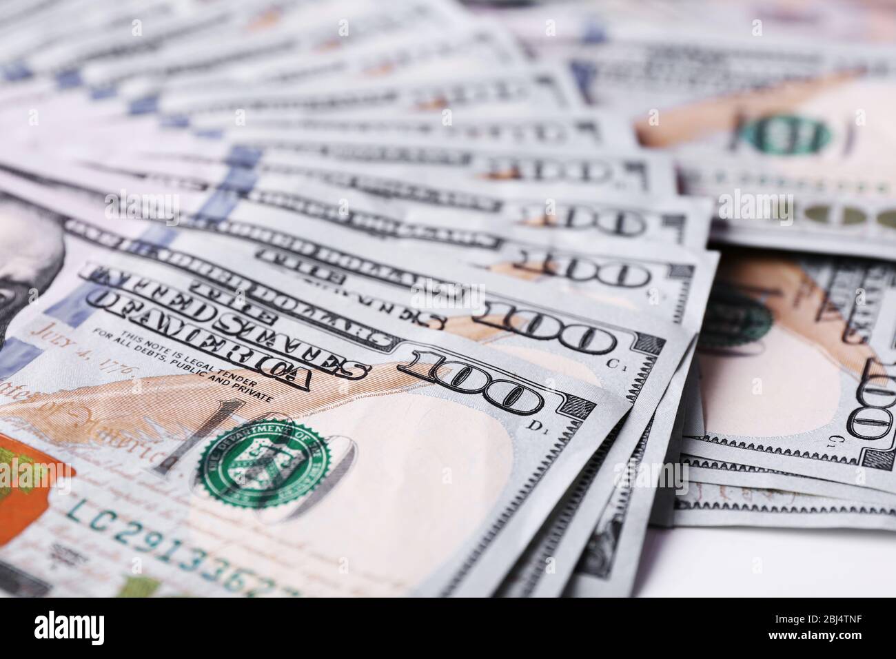 Many hundred dollars cash money as background Stock Photo - Alamy