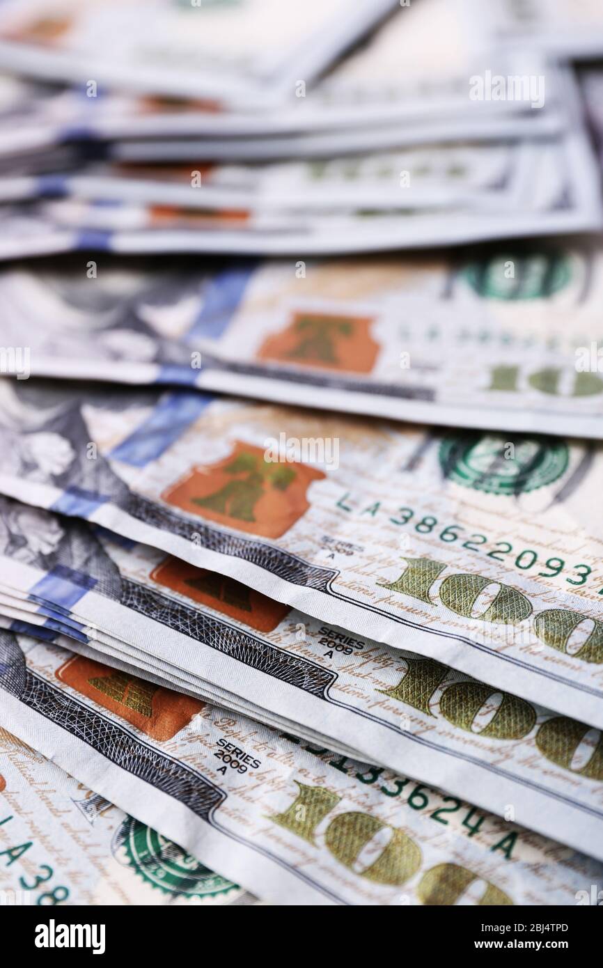 Many hundred dollars cash money as background Stock Photo - Alamy