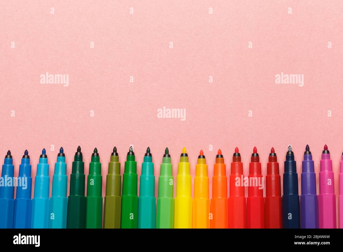 Assortment of colorful felt tip pens on pastel pink background Stock ...