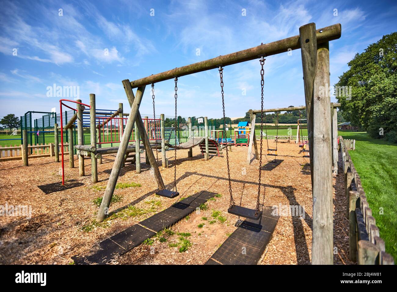 Shot of a children playground in a park during early summer Stock Photo ...