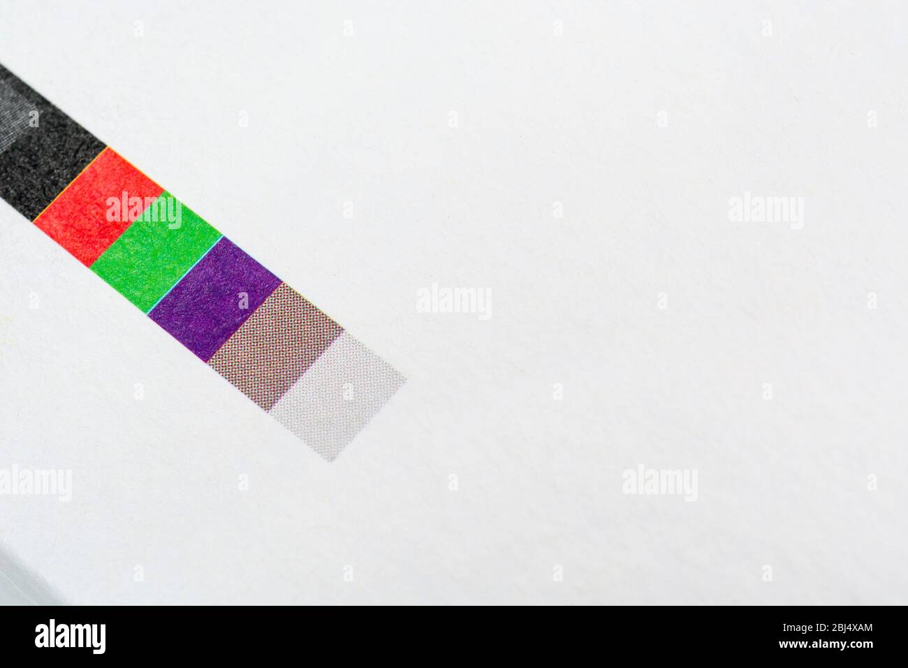 Colour registration strip on paper packaging. For CMYK process colours ...