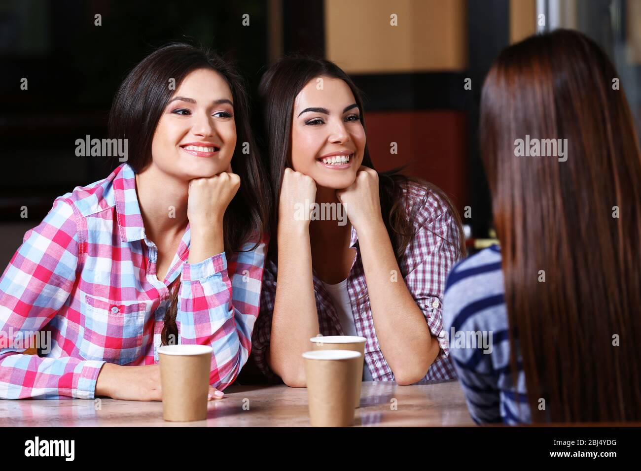 Beautiful girls in cafe Stock Photo - Alamy