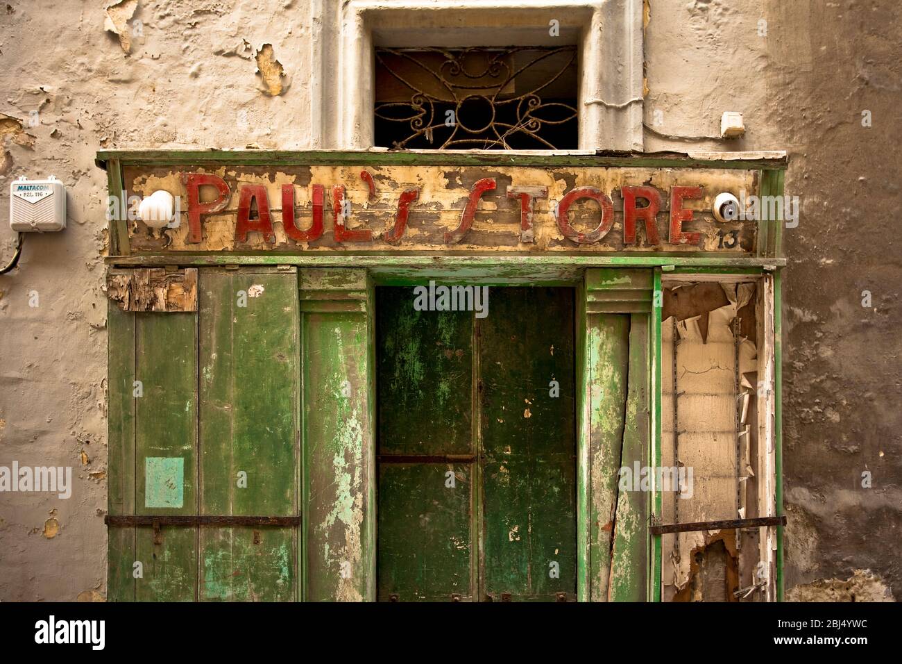 An old crumbling and derelict shopfront in Valletta in Malta Stock ...