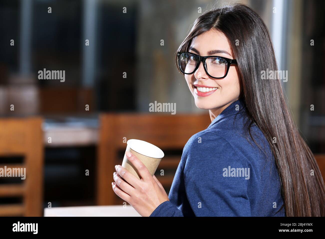 Beautiful girl poses with cup of coffee Stock Photo - Alamy