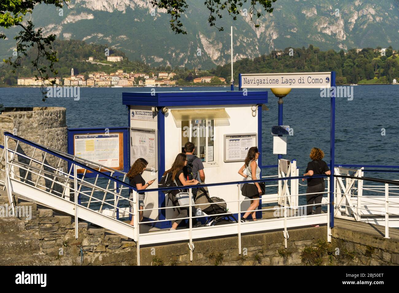 LAKE COMO - JUNE 2019: People walking down steps to the ferry landing ...
