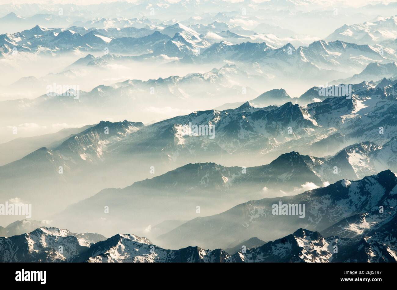 Italian Alps seen through a plane window Stock Photo - Alamy