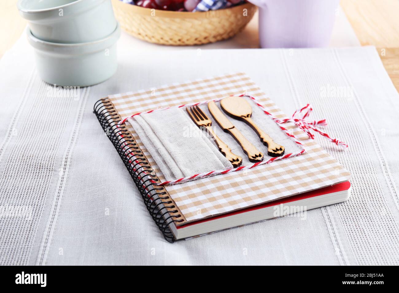 Recipe book at the kitchen on table background Stock Photo - Alamy