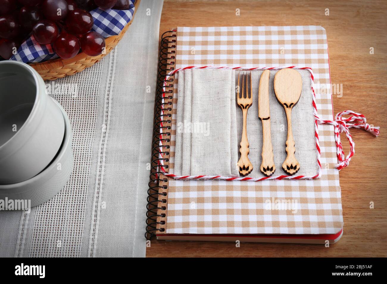 Recipe book at the kitchen on table background Stock Photo - Alamy