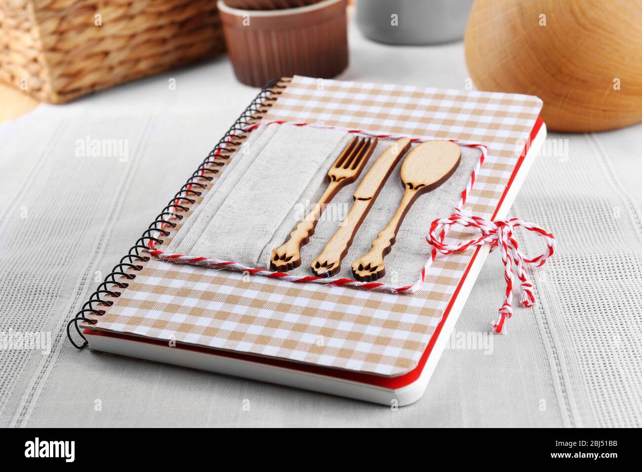 Recipe book at the kitchen on table background Stock Photo - Alamy