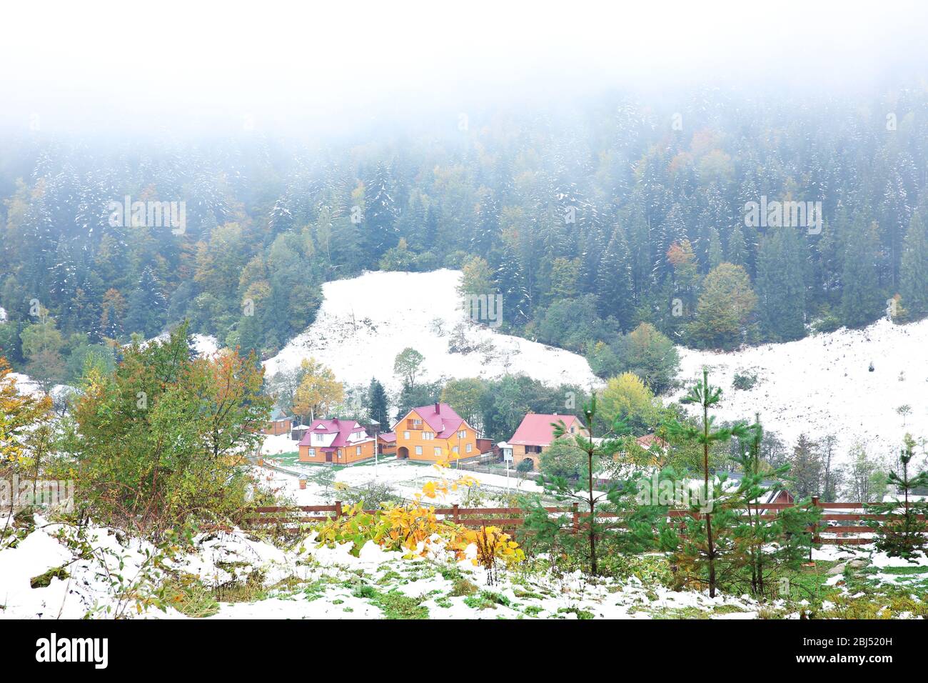 Landscape of village in mountains Stock Photo - Alamy