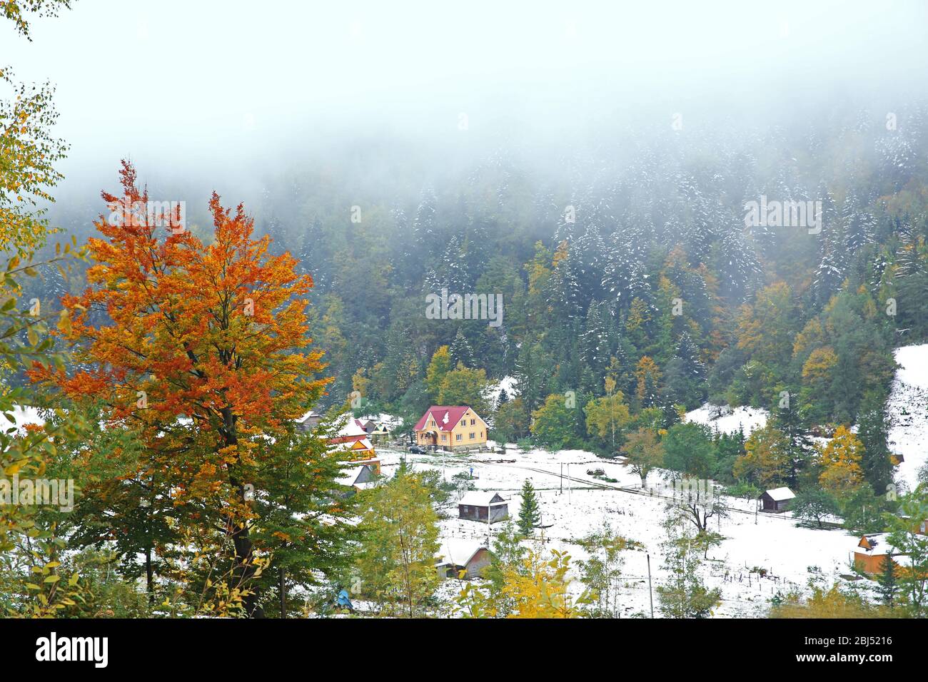 Landscape of village in mountains Stock Photo - Alamy