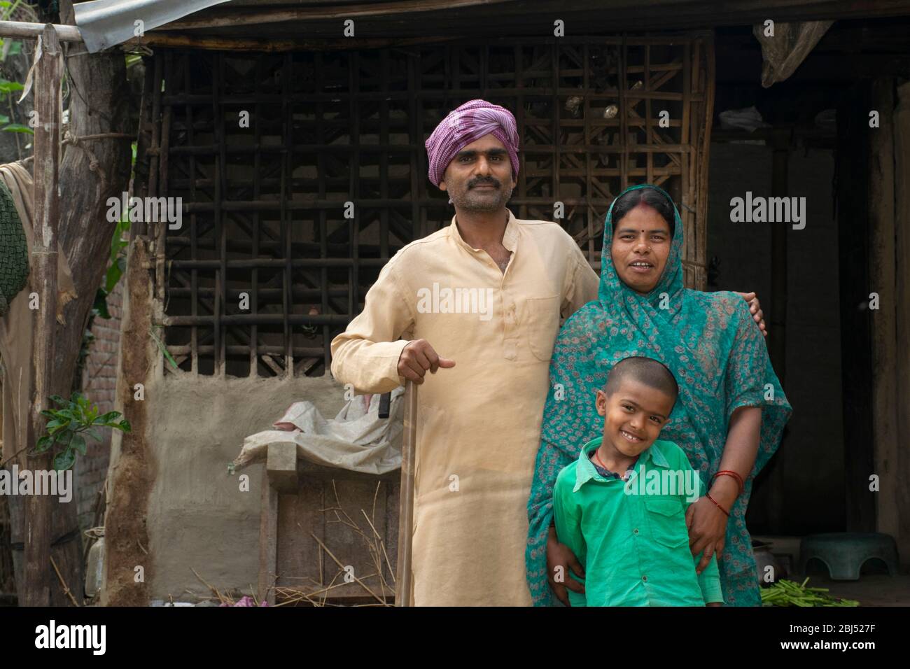 Portrait of Indian rural family smiling Stock Photo - Alamy