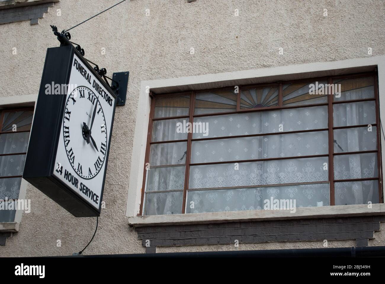 Clock and window above the offices of Frank Rivett & Sons Funeral ...