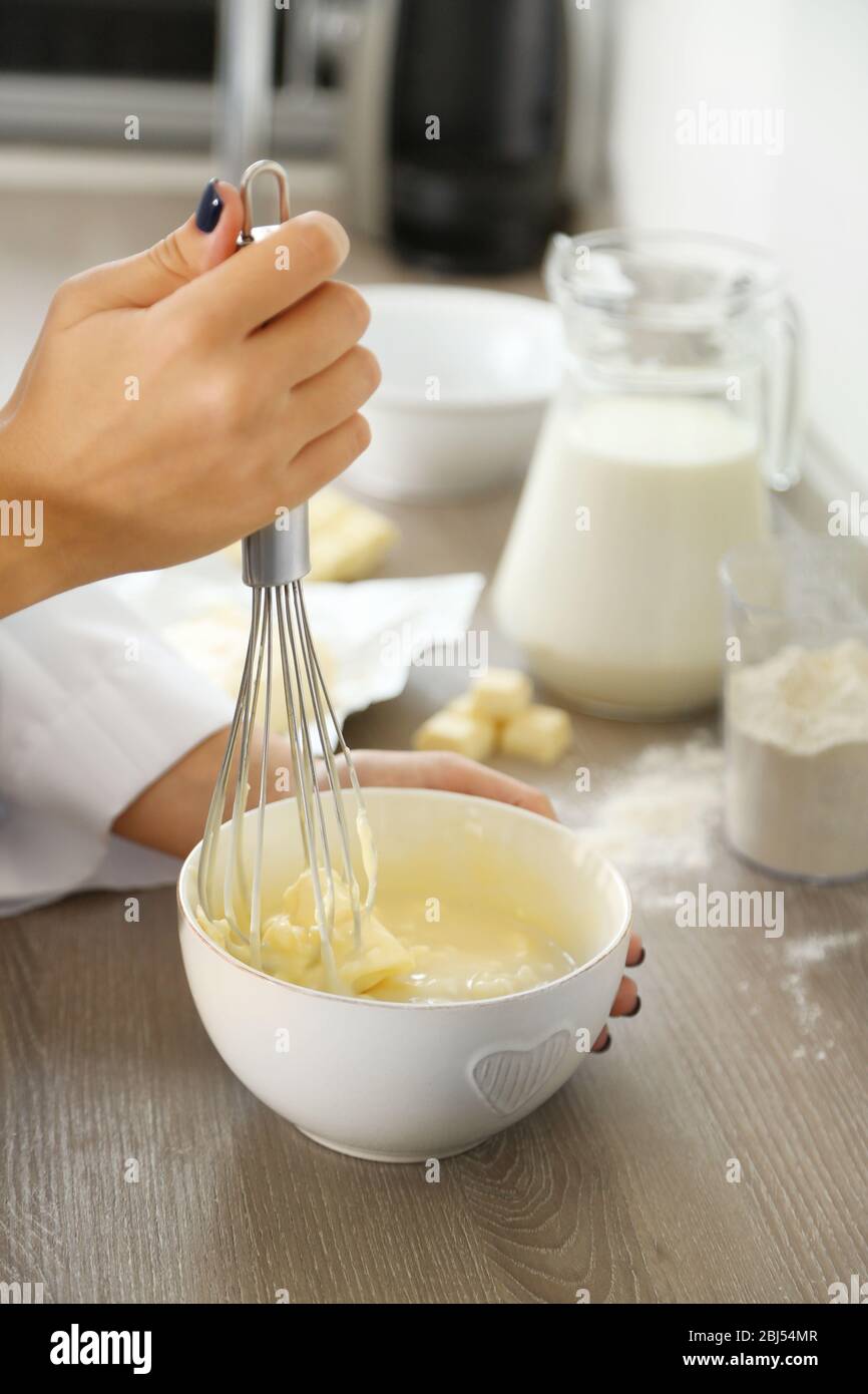 Cooking buttery cream on kitchen Stock Photo - Alamy
