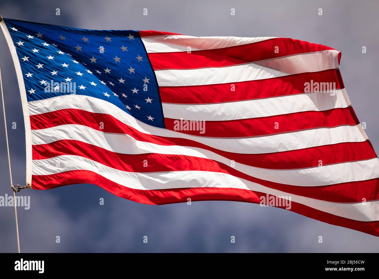 Flag of the USA flies in the wind Stock Photo - Alamy