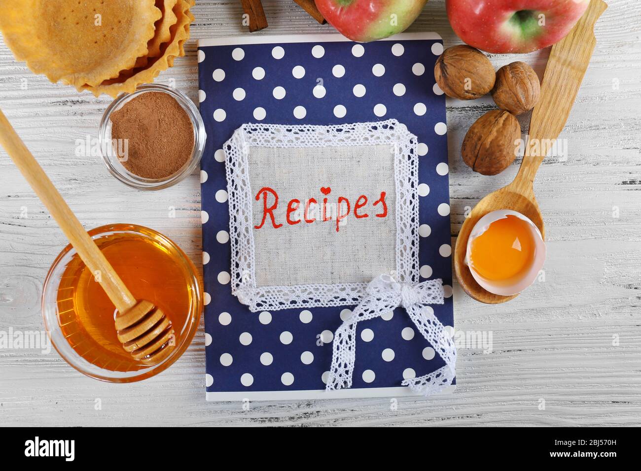 Recipe book on a table with ingredients for baking Stock Photo - Alamy