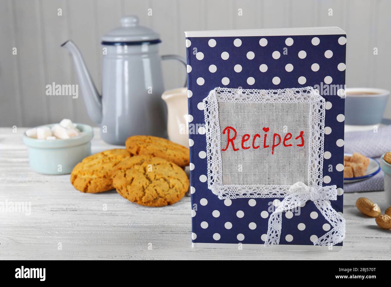 Recipe book on a table with ingredients for baking Stock Photo - Alamy