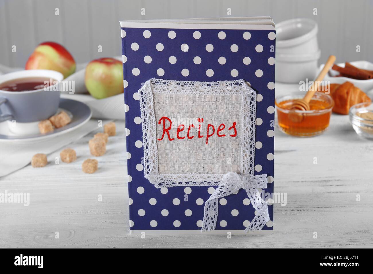 Recipe book on a table with ingredients for baking Stock Photo - Alamy