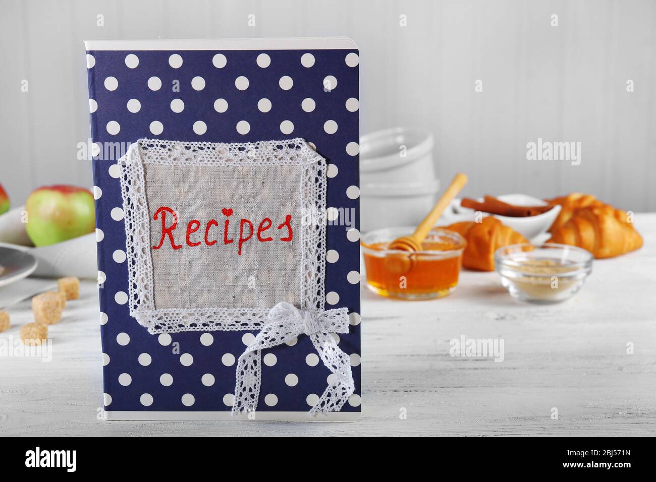 Recipe book on a table with ingredients for baking Stock Photo - Alamy