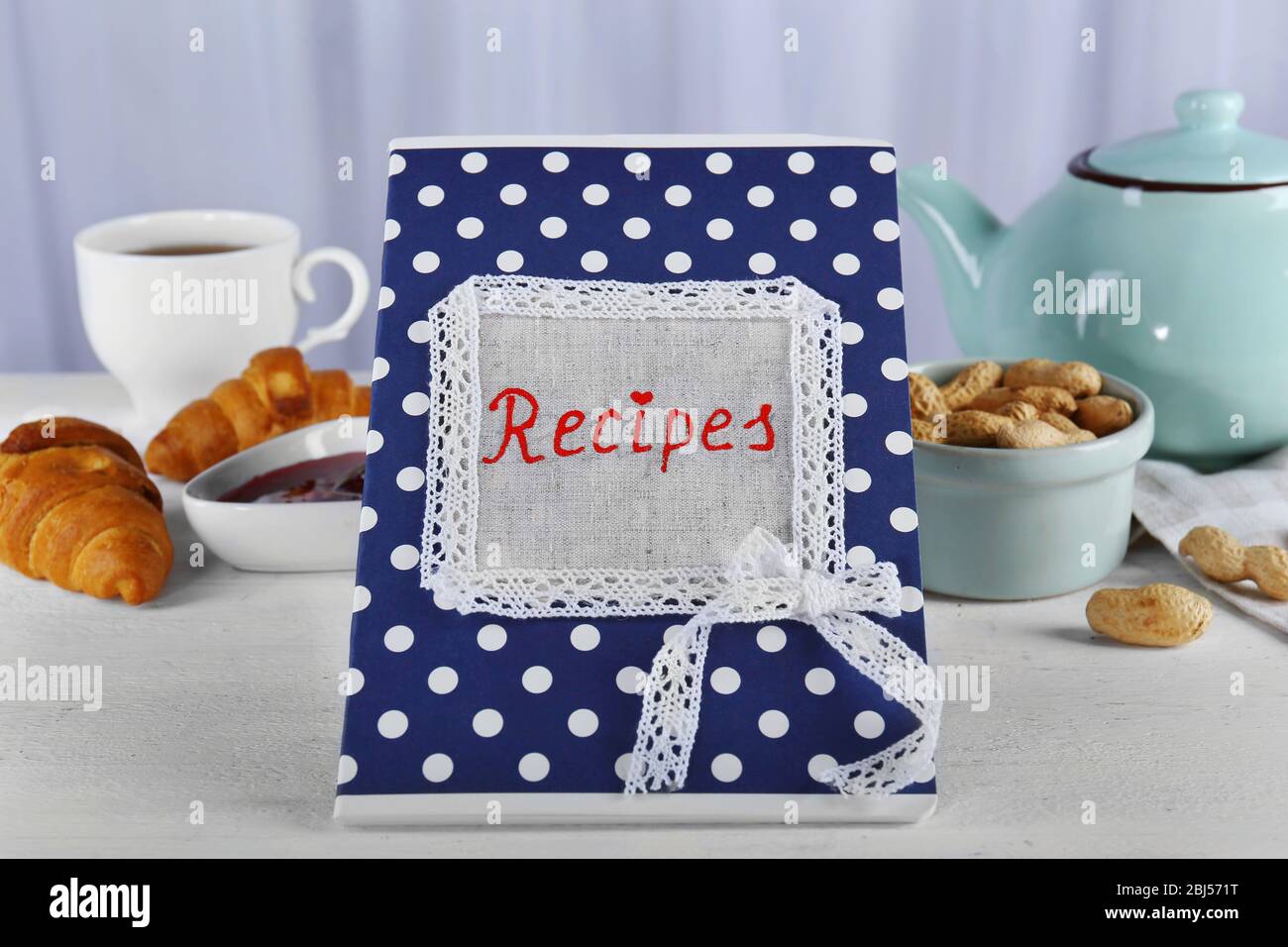 Recipe book on a table with ingredients for baking Stock Photo - Alamy